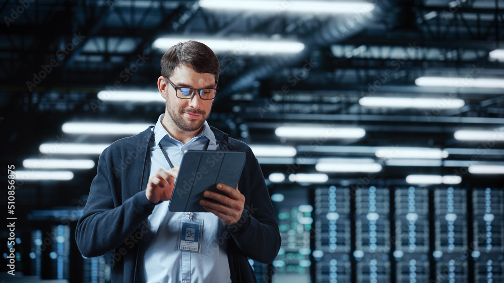 Successful Data Center IT Specialist Using Tablet Computer. Server Farm ...