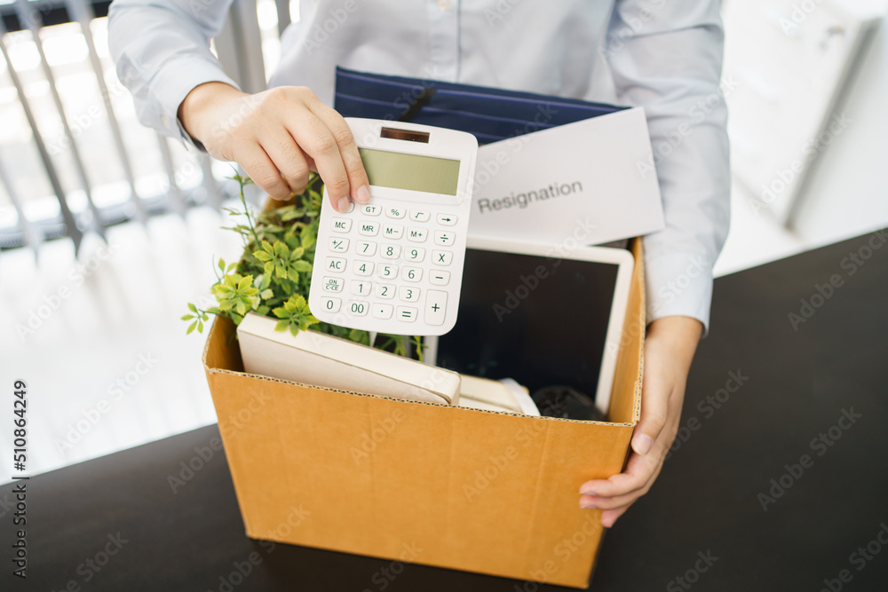 Concept of leaving job, Female employee packing personal belonging and ...