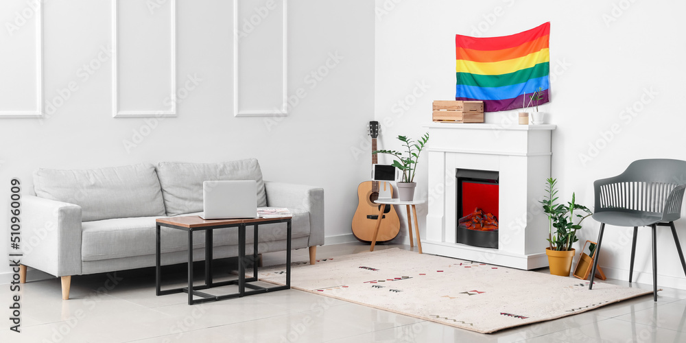 Interior of modern living room with sofa, fireplace and LGBT flag Stock ...