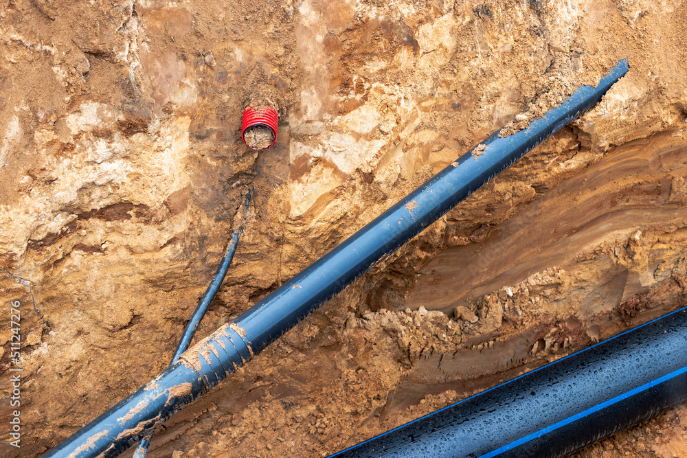 The high voltage electrical cable is laid in a trench under existing ...