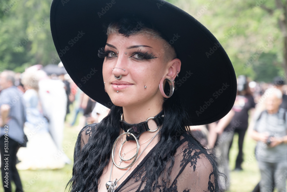 Young, smiling, female goth in black outfit on the annual Wave Gotik ...