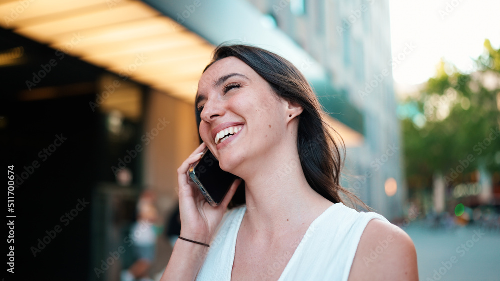 Beautiful woman with freckles and dark loose hair wearing white top is ...