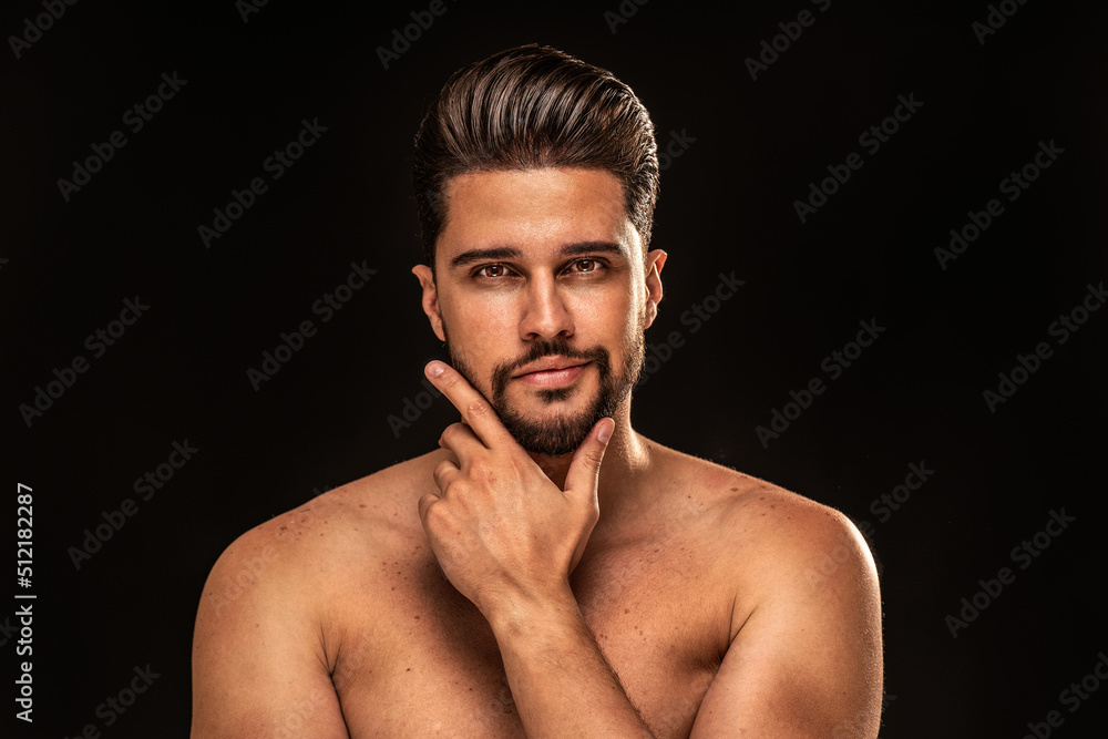 Handsome sensual man with brown eyes posing shirtless on black studio ...