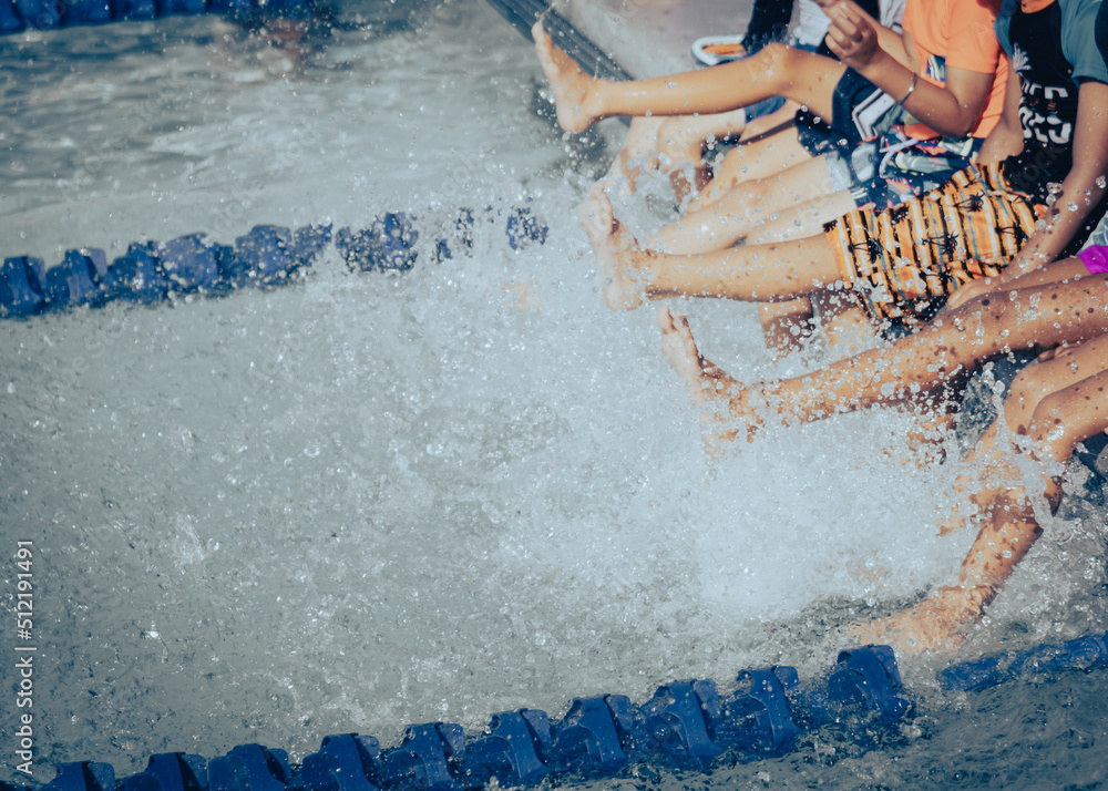 Toned photo group of diverse multiethnic children kicking splashing ...