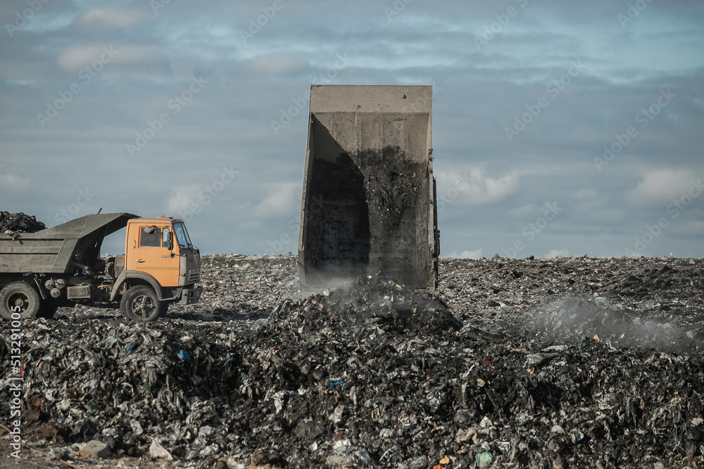 Recycling concrete and construction waste from demolition. Excavator at ...