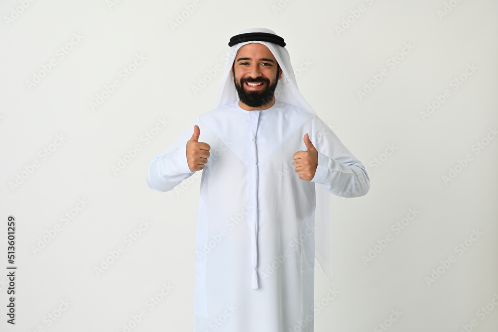 Happy Arab Emirati man thumbs up isolated on white background wearing ...