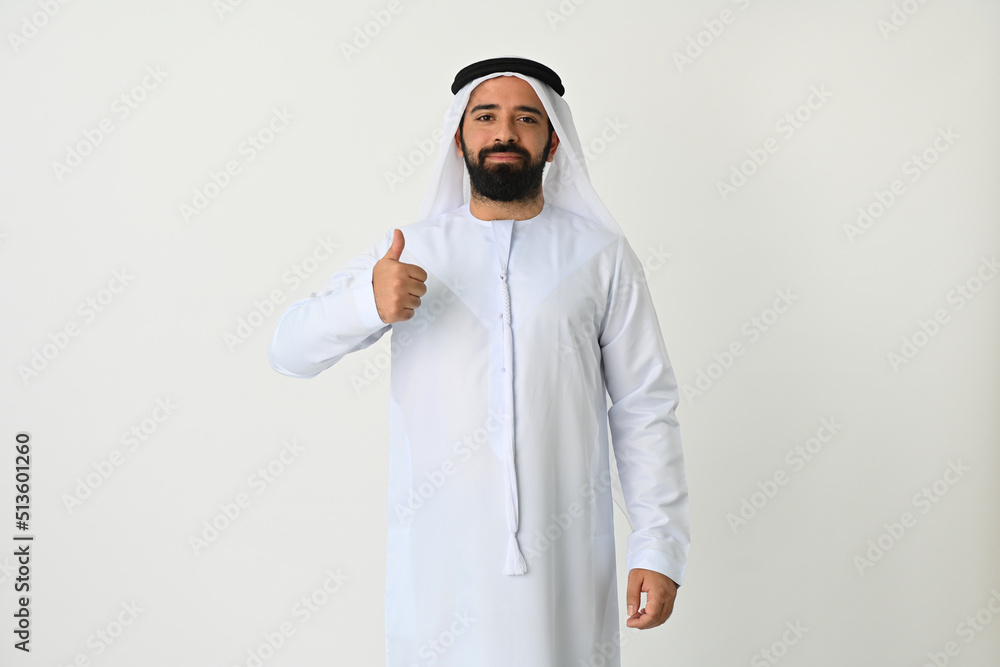Happy Arab Emirati man thumbs up isolated on white background wearing ...