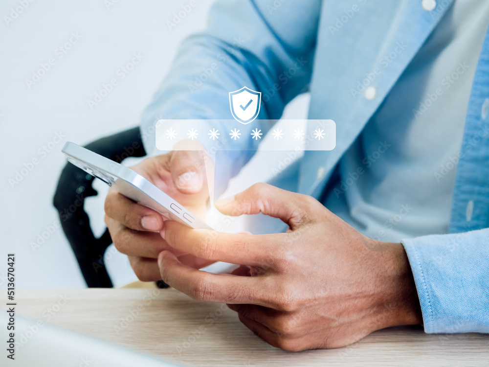 Two factor authentication concept. Virtual safety shield icon while access on phone with laptop ...