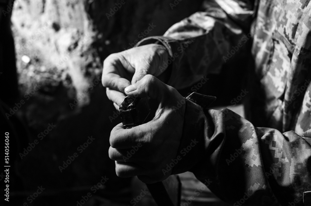 Filling the magazine with combat military assault rifles AK 74, a ...