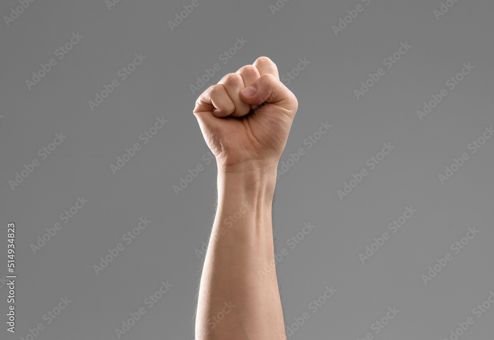 fight, aggression and gesture concept - close up of male hand showing ...