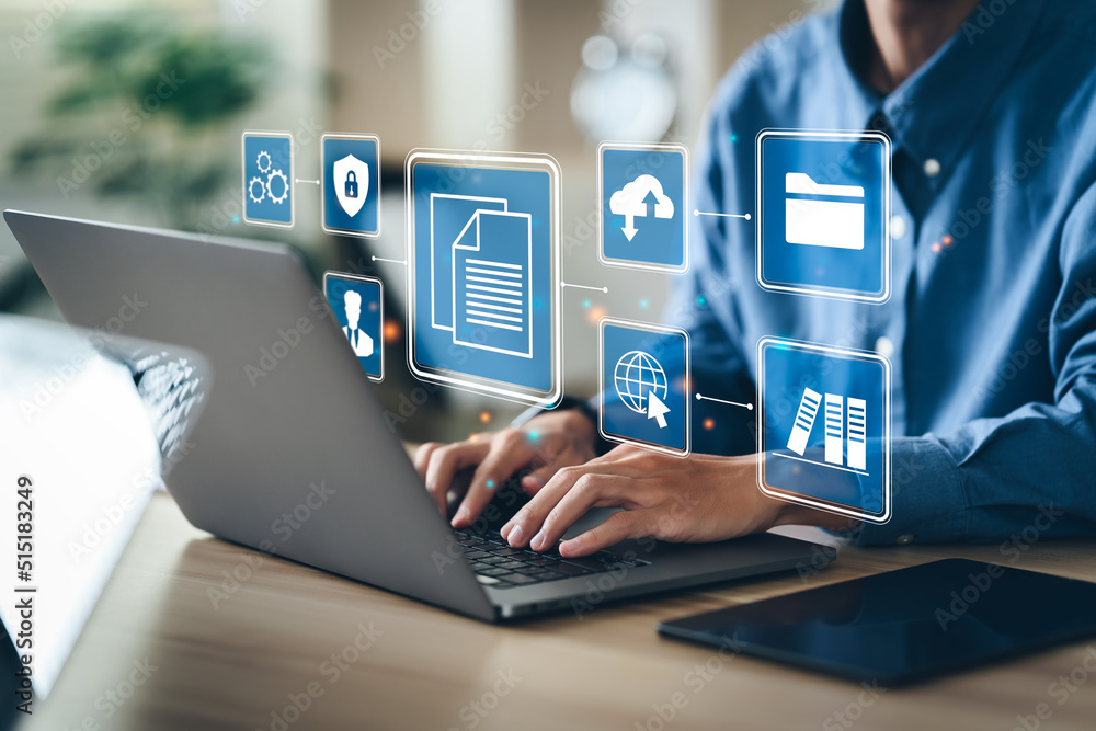 Businessman using a computer to document management concept, online documentation database and ...
