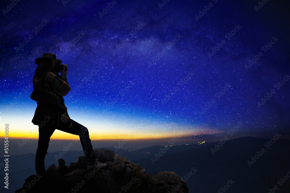 Photographer doing astro photography in a mountain morning scape with ...