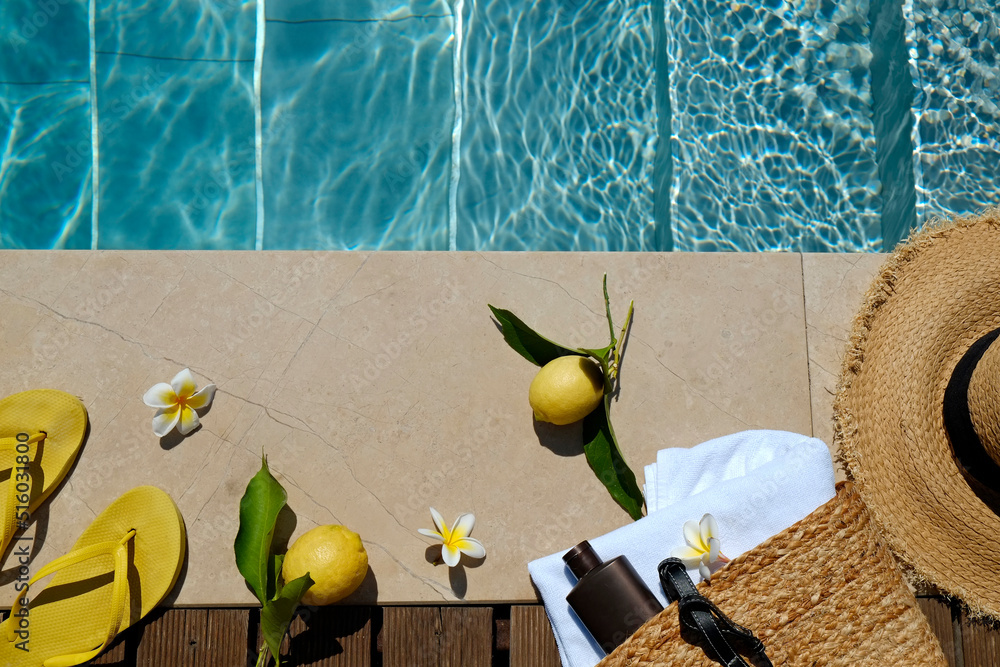 Swimming pool essentials concept. Beach bag with items for safe ...