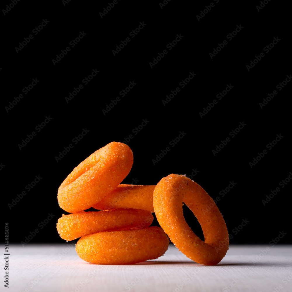 closeup side view of crispy doughnut or donut, crunchy deep fried snack ...