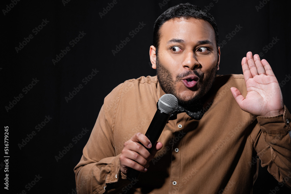 emotional indian stand up comedian showing stop gesture while telling ...