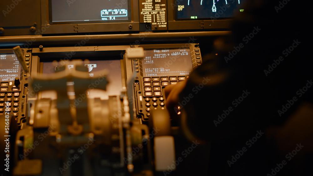 Foto de Stock Male copilot inserting flight coordinates to arrive at ...