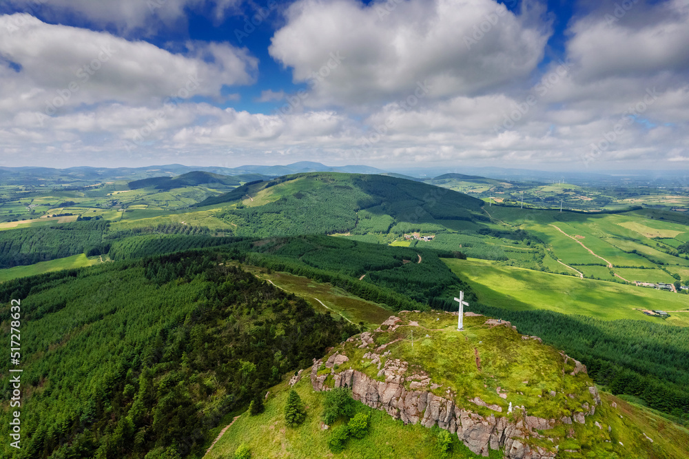 Tall white Catholic cross on top of Devils bit mountain in county ...