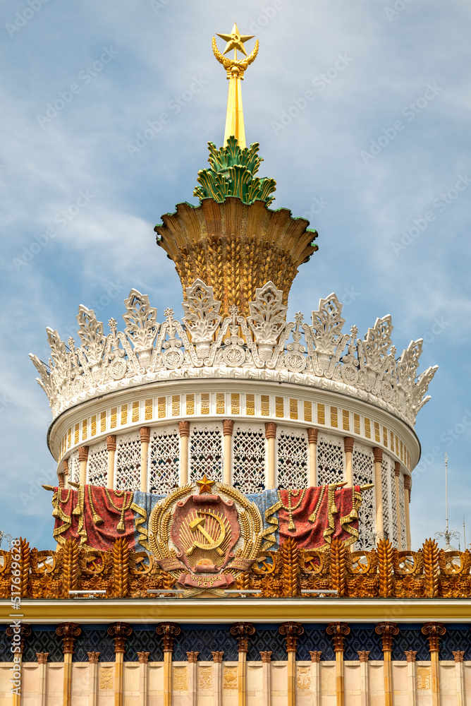 gilded spire with star and bas-relief group of sickles and hammers with ...