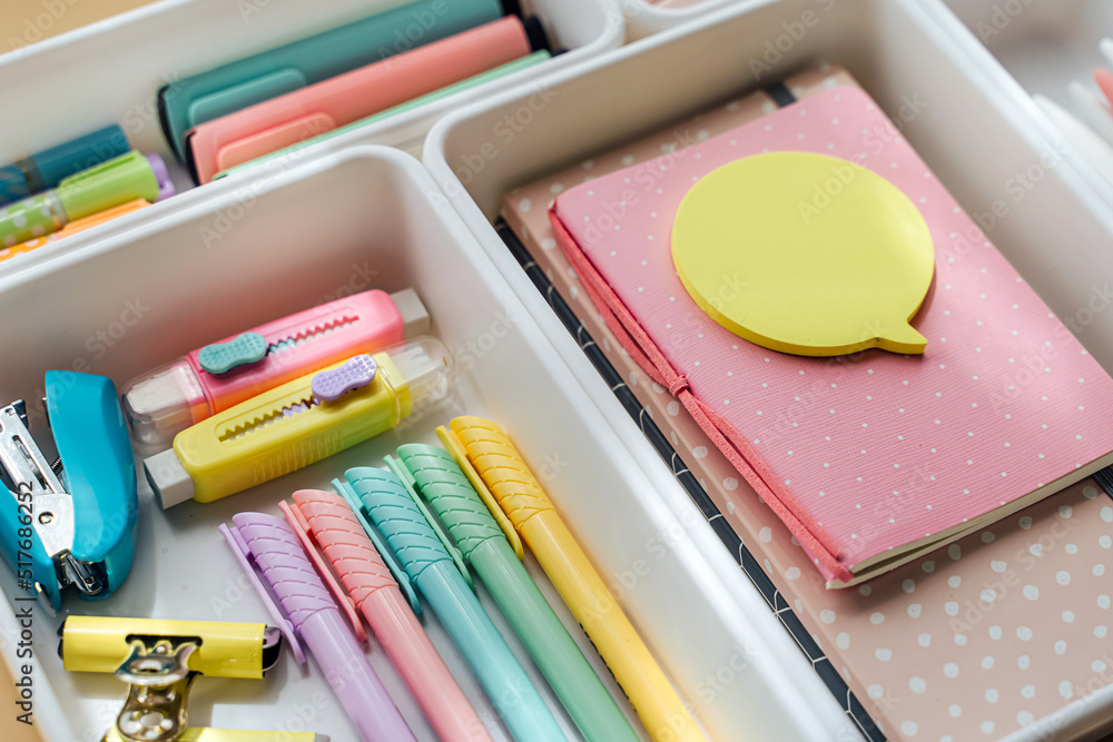Stylish colored stationery in pastel colors is arranged in white ...