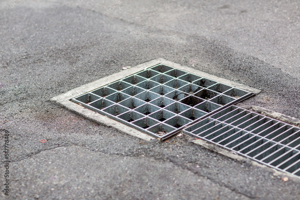 Grille drain of sewer around the street or walkway . Water ...