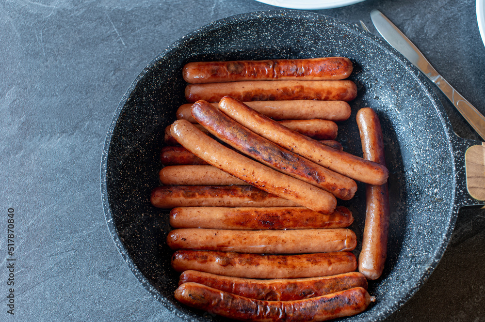 Fried vienna sausage in a frying pan Stock Photo | Adobe Stock
