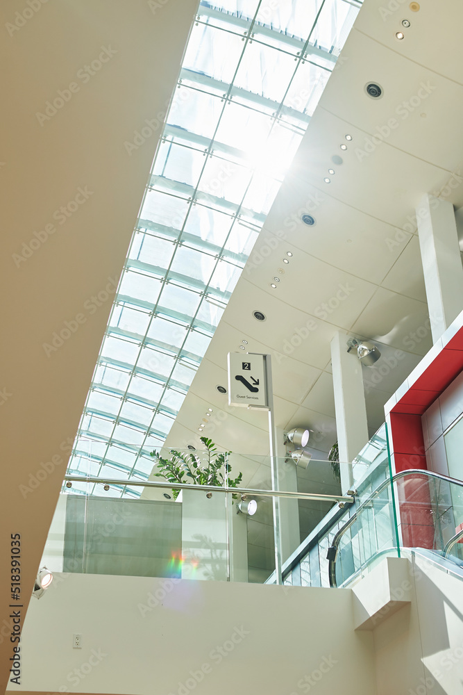 Large white space with big square windows strong ray of sunlight round ...