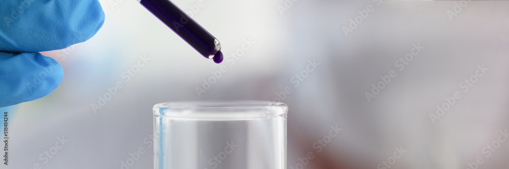 Chemist conducts analysis of water samples versions of reagents using ...