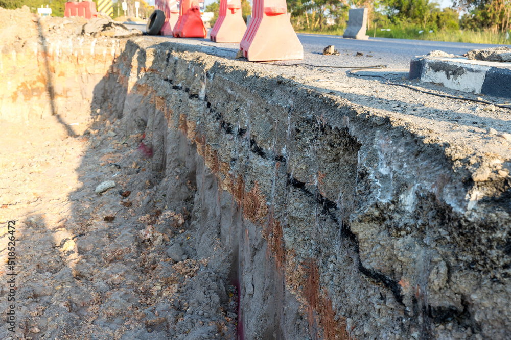 Side of the broken asphalt road collapsed and fallen. Road collapses ...