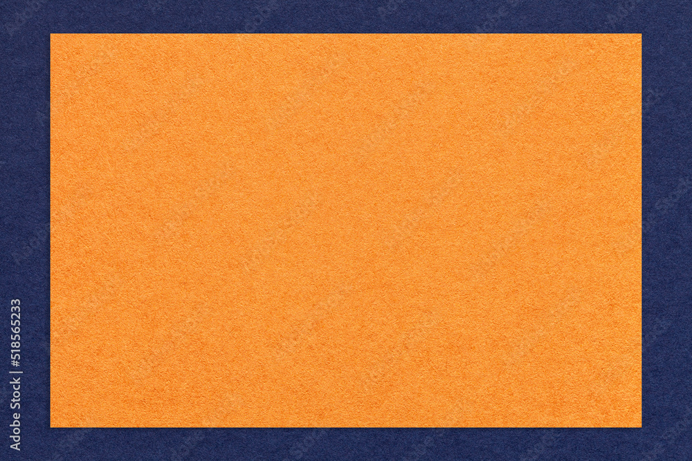 Texture of craft orange color paper background with navy blue border ...