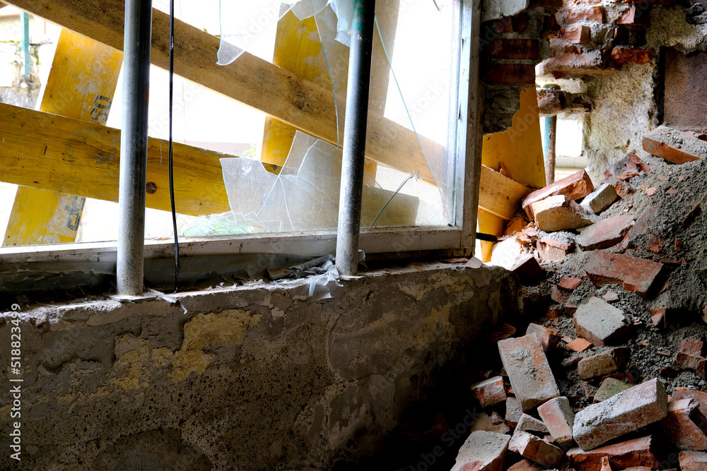 ruined room in abandoned building with broken windows without glass ...