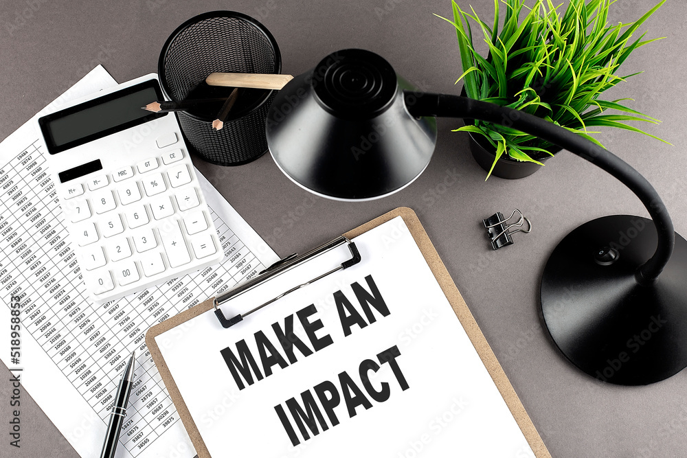 Clipboard ,chart and calculator, lamp and workspace accessories on a ...