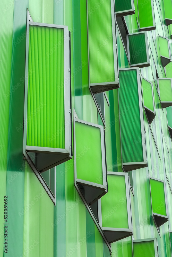 Modern green building with opened windows Stock Photo | Adobe Stock