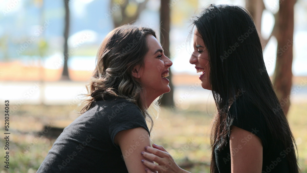 Foto de Stock Lesbian couple kissing each LGBT Girlfriend kisses female mate at the park | Adobe ...