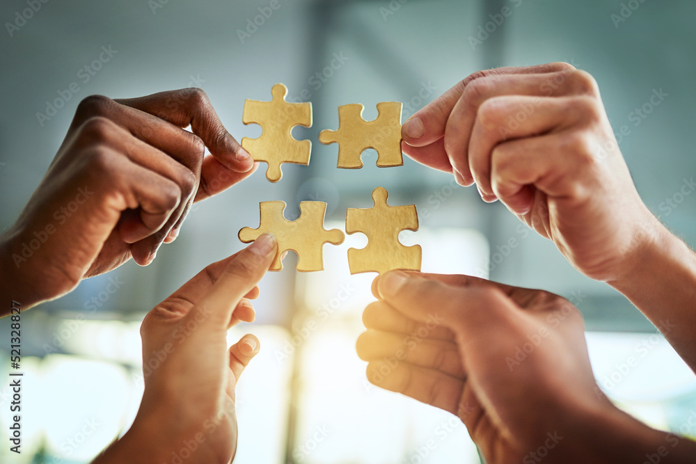 Teamwork, unity, collaboration by a group of business people completing ...