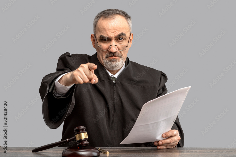 Foto de Stock Judge banging judge's gavel, index finger pointing. Law ...