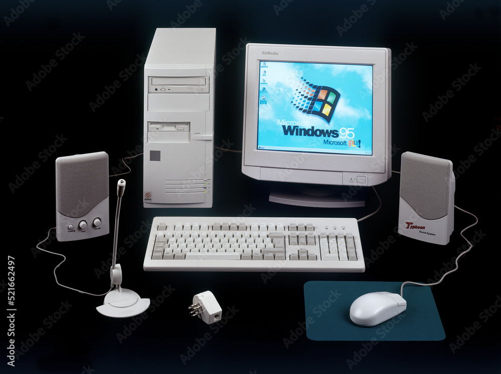 Nineties obsolete tower pc computer and Windows 95 logo on screen. の ...