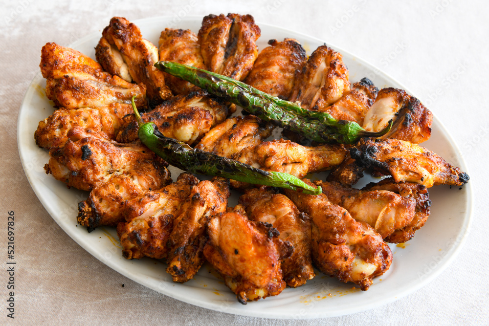 Chicken wings barbeque in a dish with BBQ grill sauce . Izgara tavuk ...