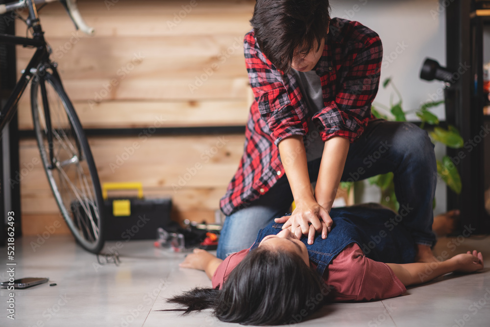 First aids emergency CPR on heart attack woman laying unconscious in home, One part of the ...