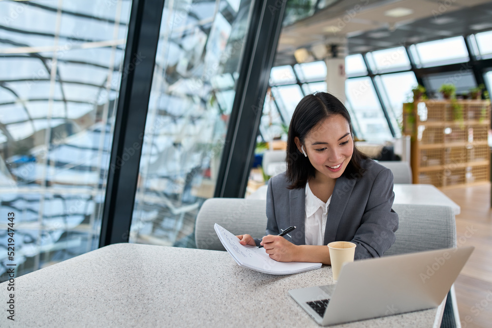 Young Asian business woman employee or executive manager using computer ...