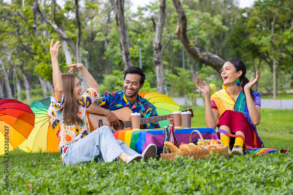 Group of young diversity LGBTQ friend having a picnic in the garden ...