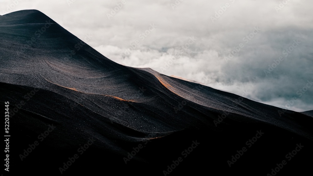 Minimal dark wallpaper. Black mountain with grey clouds, sand dunes ...