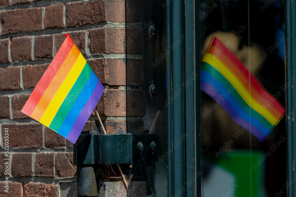 Celebration of pride month in Amsterdam, Rainbow flag hanging outside ...