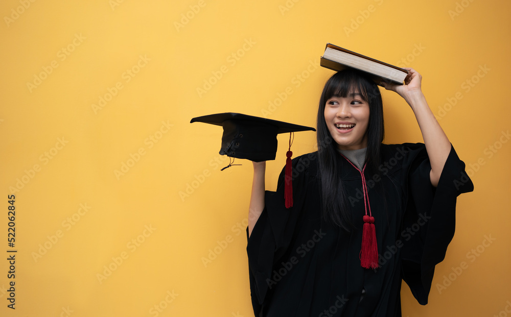 Happy graduate Beautiful Asian girl with a diploma, shows a gesture of ...