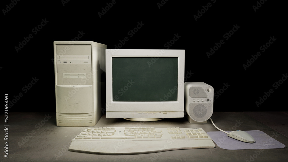Old dirty computer with vintage monitor sitting on a dark table on a ...