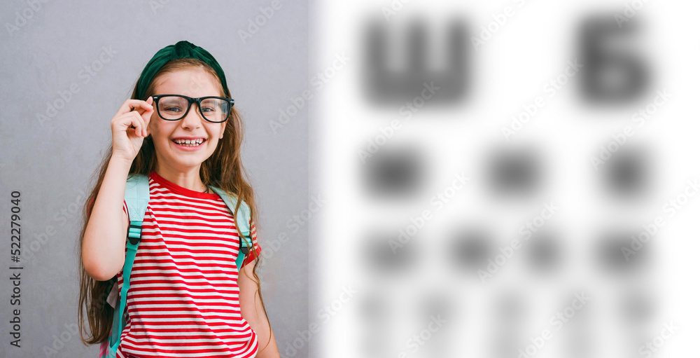 Checking the vision of a child of an 8-year-old girl with an ...