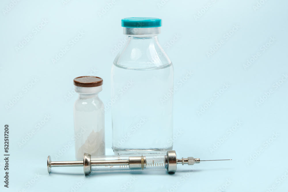 Set for injections. Side view on a blue background. Vintage syringe ...