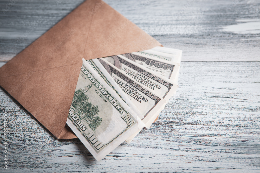 dollar bills in an envelope Stock Photo | Adobe Stock