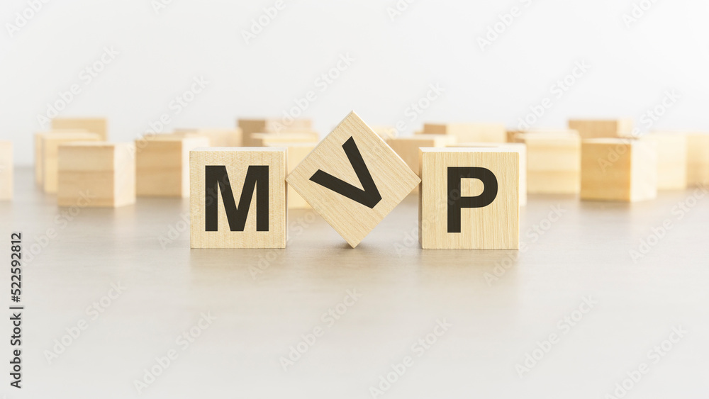 wooden cube with the letter from the mvp word. mvp - Minimum Viable ...
