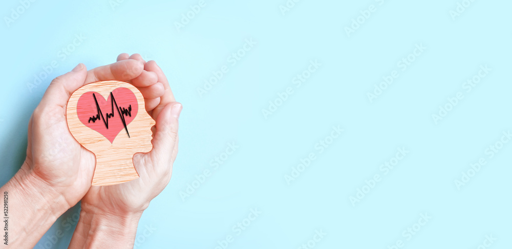 Hands holding wooden brain and heart, brain stroke, world heart day ...
