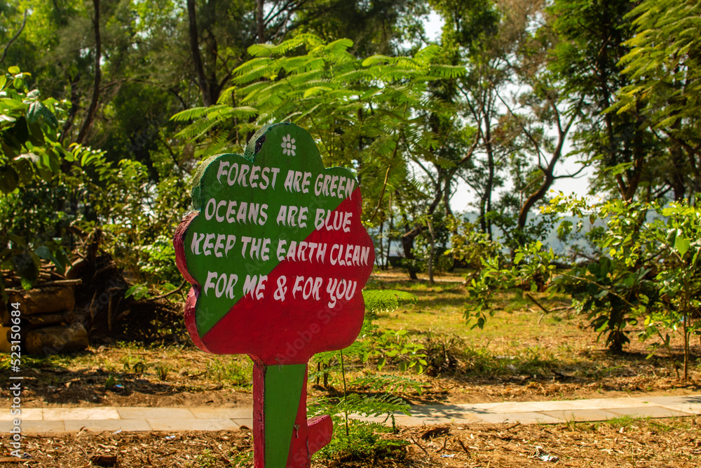 Concrete Sign board with text message to save our forest and oceans ...